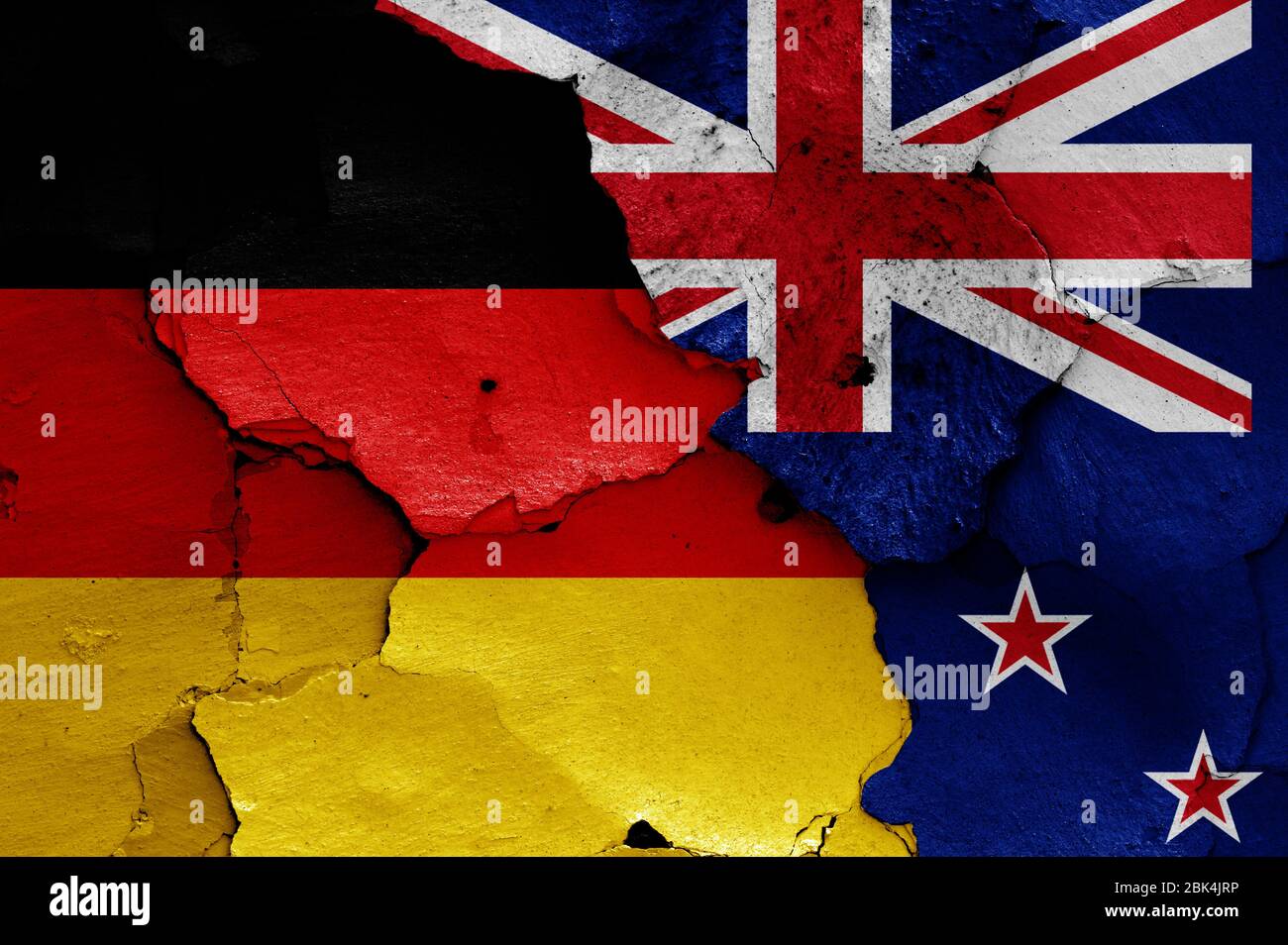 flags of Germany and New Zealand painted on cracked wall Stock Photo ...