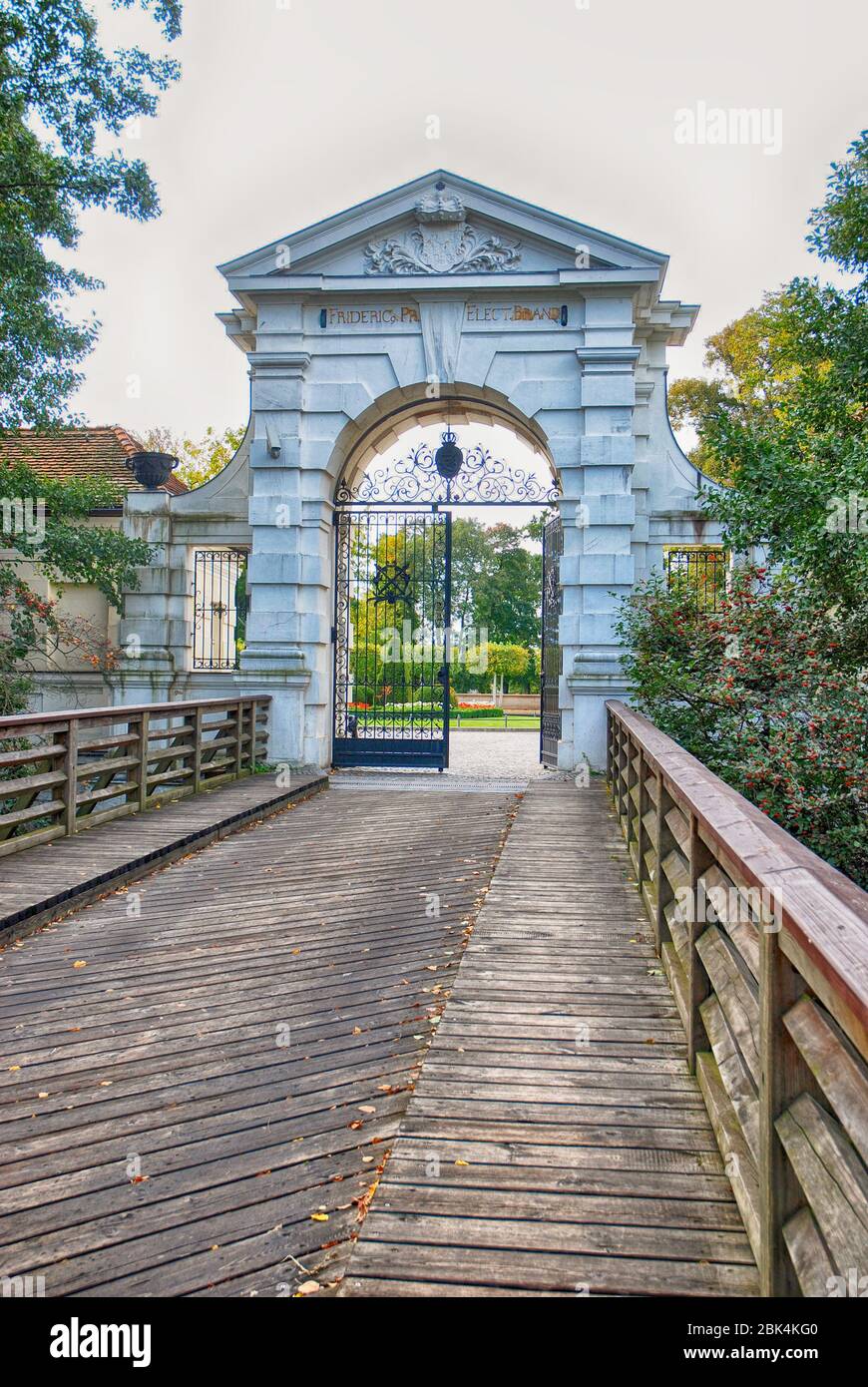entry gate with wooden brigde of the water castle Koepenick, Berlin ...