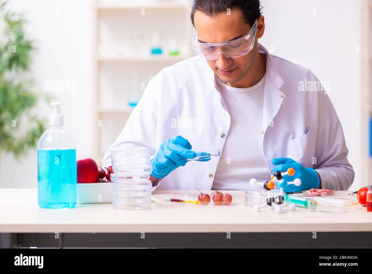 Young nutrition expert testing food products in lab Stock Photo - Alamy