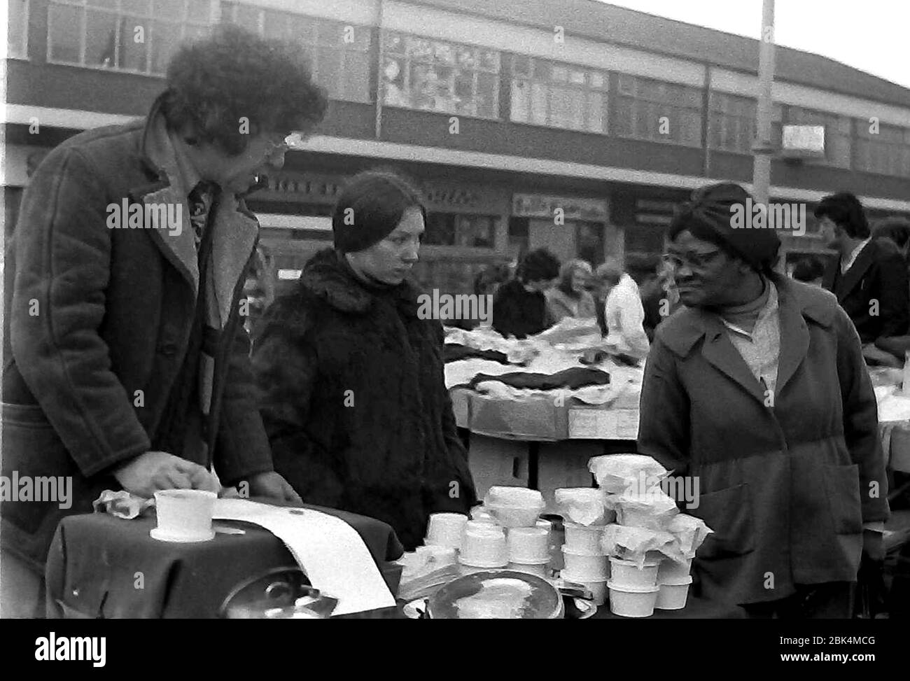 Customers look at a stall outdoors on Longsight Market, Dickenson Road ...
