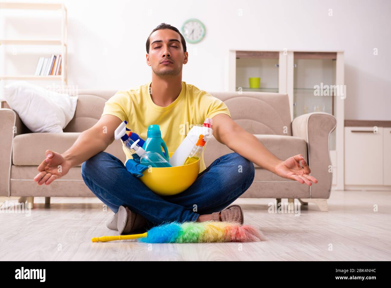 Young contractor doing housework at home Stock Photo - Alamy