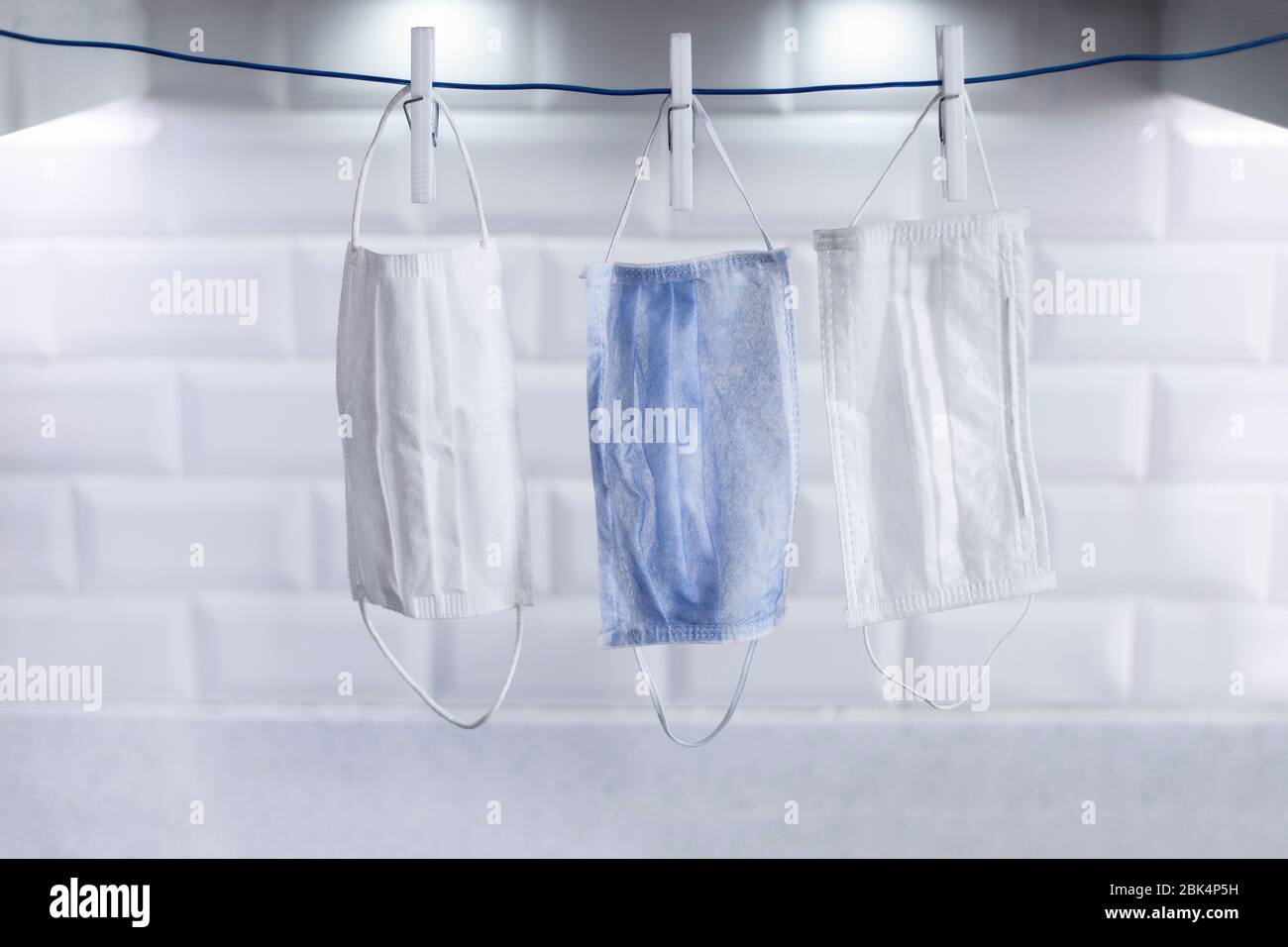 To dry the face mask by hanging it on a rope Stock Photo - Alamy