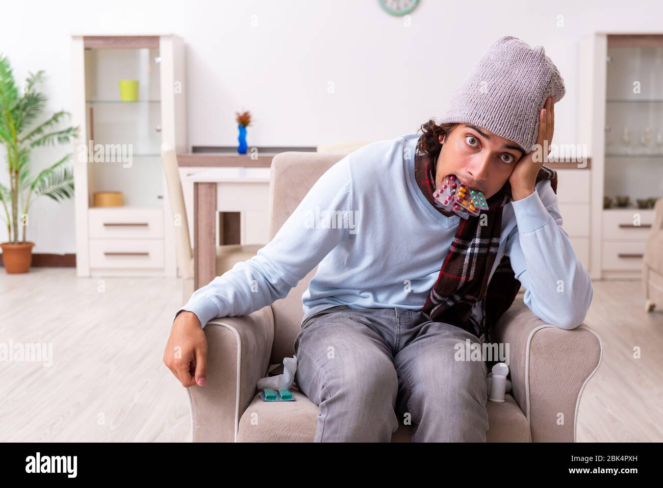 Young man suffering from flu at the home Stock Photo - Alamy
