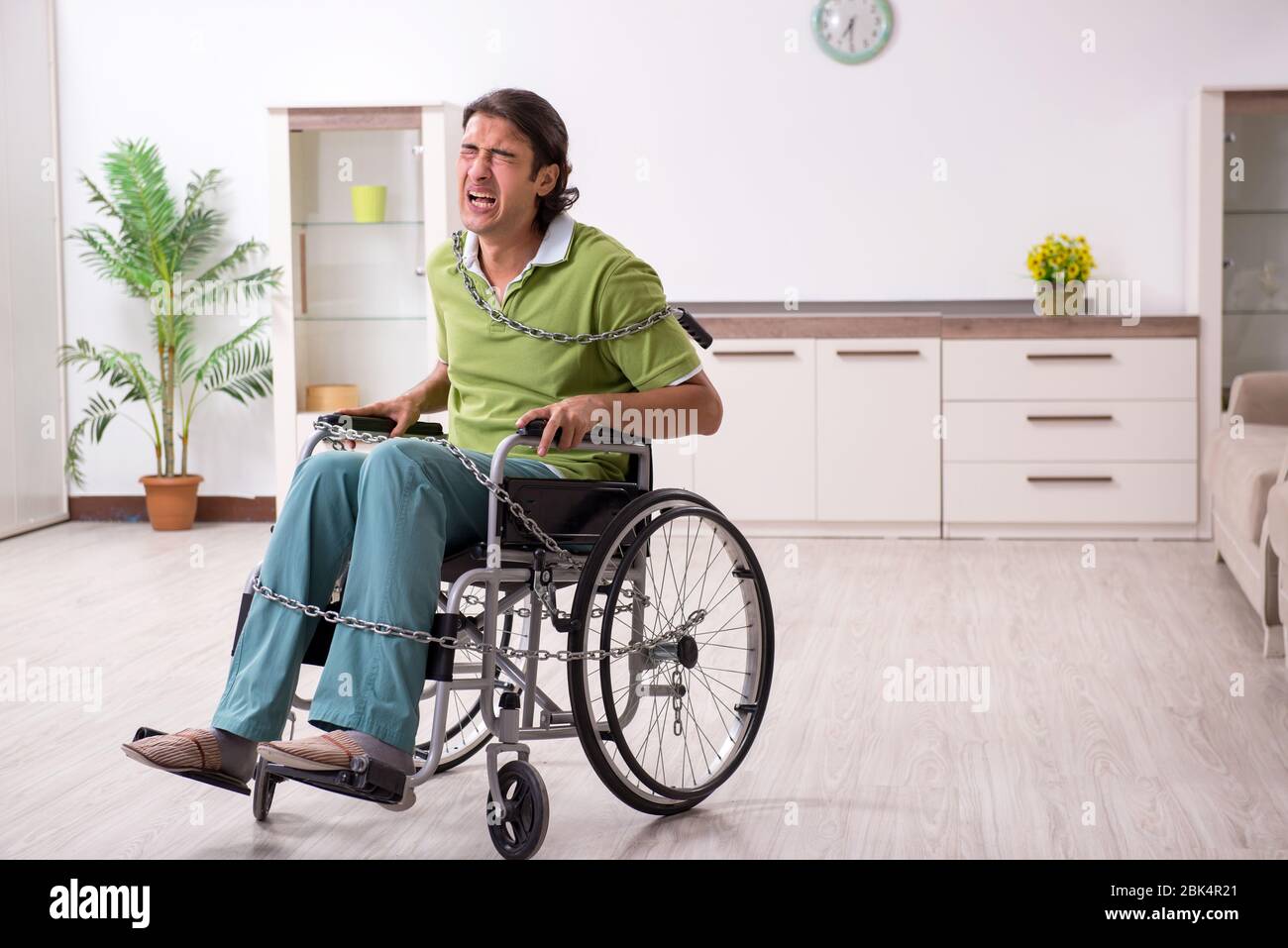 Restrained wheelchair hi-res stock photography and images - Alamy