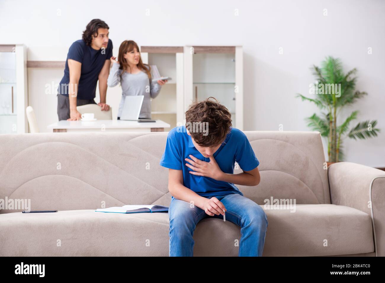 The concept of underage smoking with young boy and family Stock Photo ...