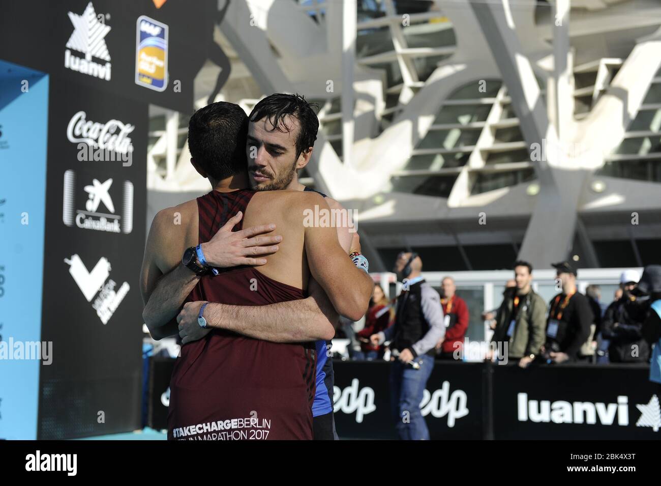 VALENCIA, SPAIN - 1 DECEMBER 2019: runners hugging at the finish line ...