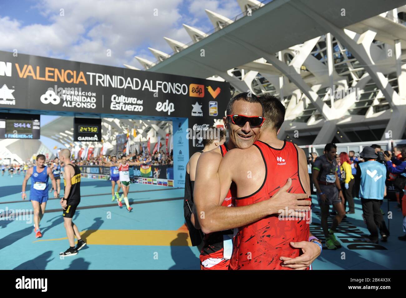 VALENCIA, SPAIN - 1 DECEMBER 2019: runners hugging at the finish line ...