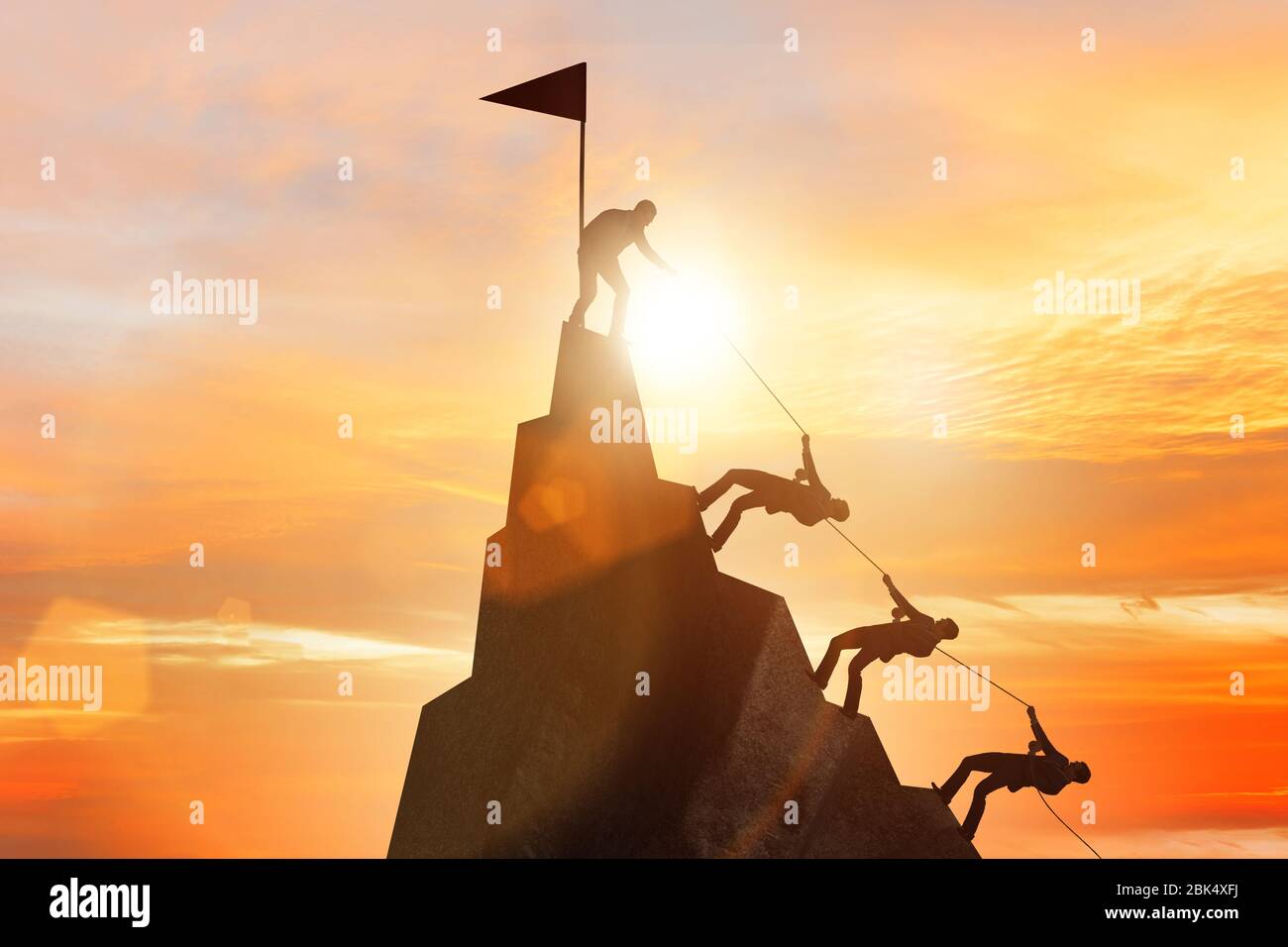 Concept of teamwork with team climbing mountain Stock Photo - Alamy