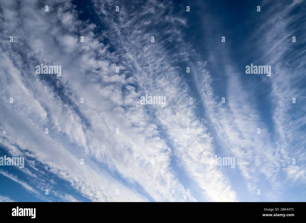 Stunning cirrus cloud formation panorama in a deep blue sky Stock Photo ...