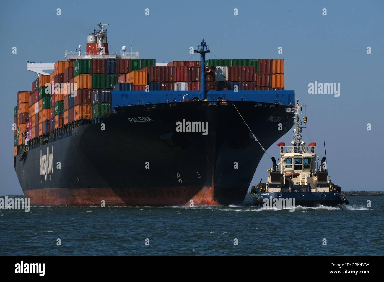 A cargo ship enters the port of Rotterdam port on April 21, 2020 in ...