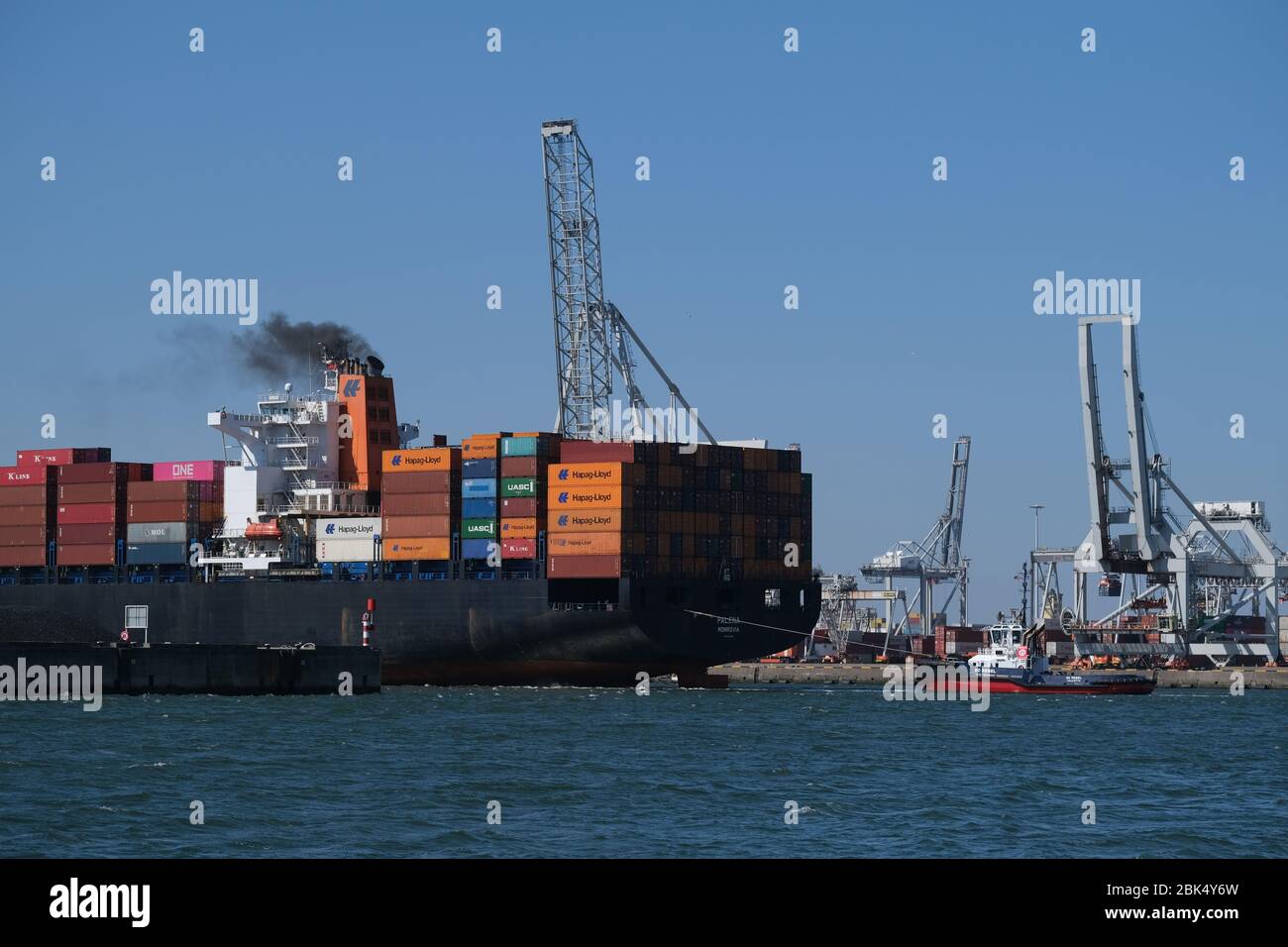 A cargo ship enters the port of Rotterdam port on April 21, 2020 in ...