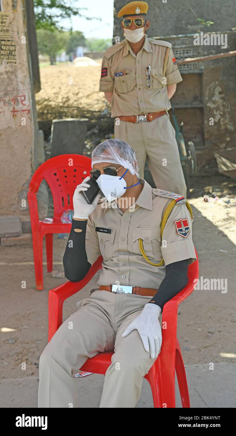 Beawar, India. 01st May, 2020. An Indian police officer wears an N95 ...