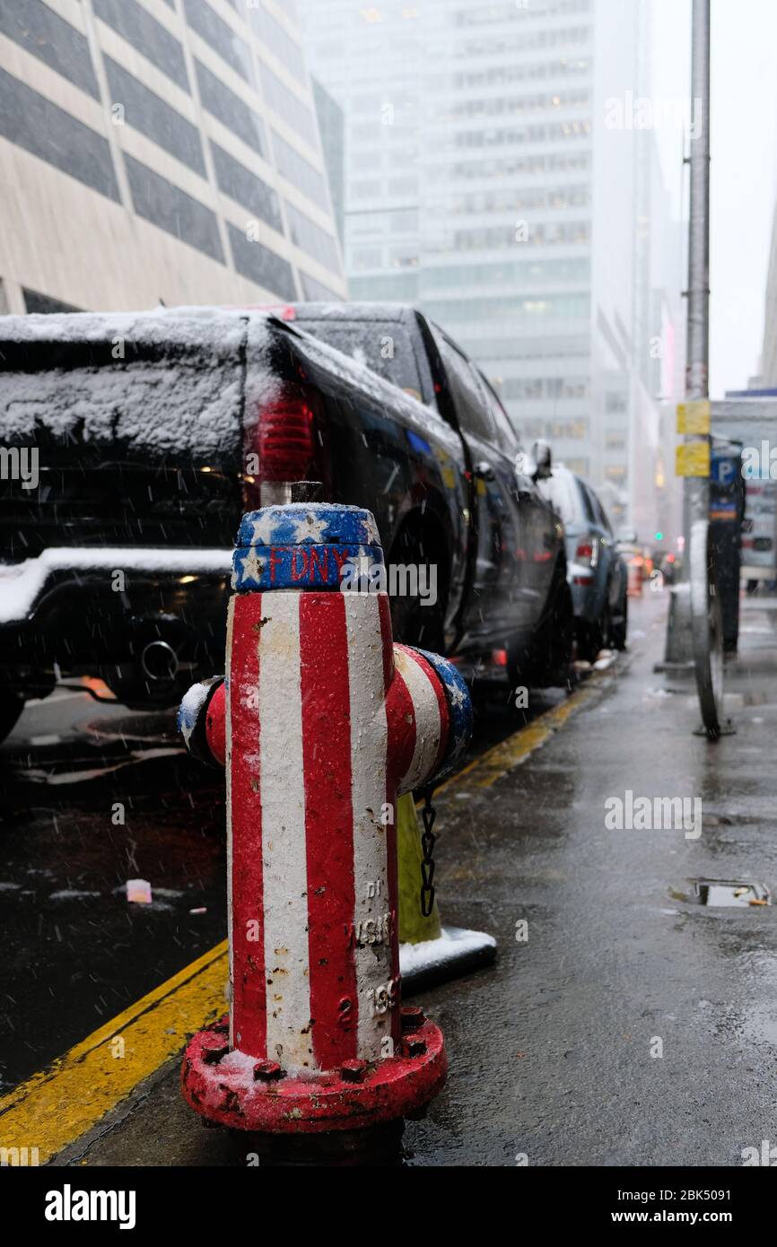 A fire hydrant which is painted with the colours of the United States ...