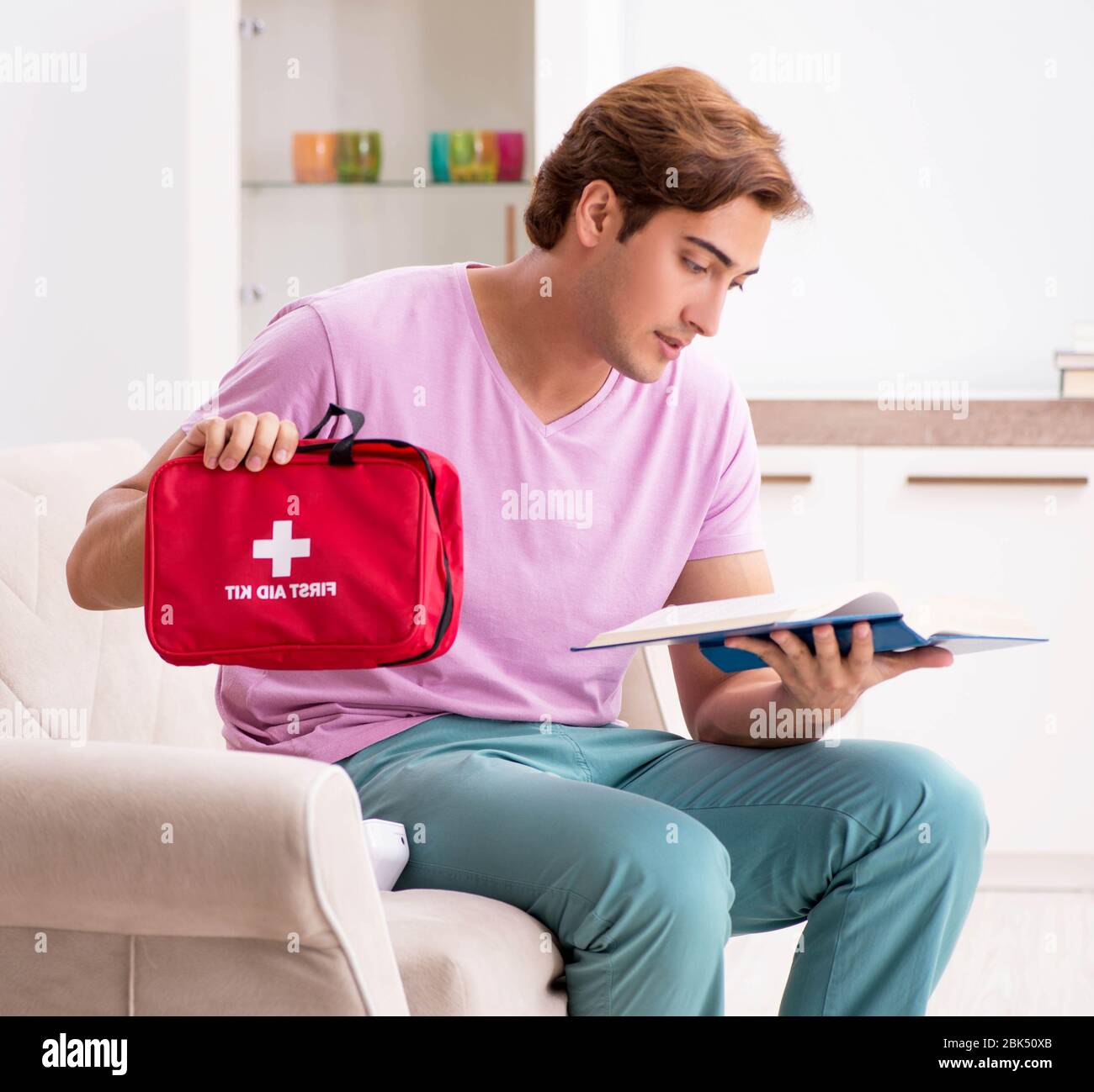 The sick man at home with first aid kit Stock Photo - Alamy