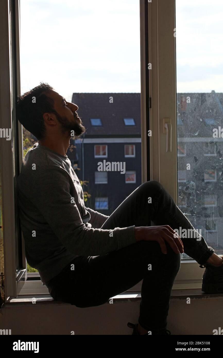 Man Looking Through A Window