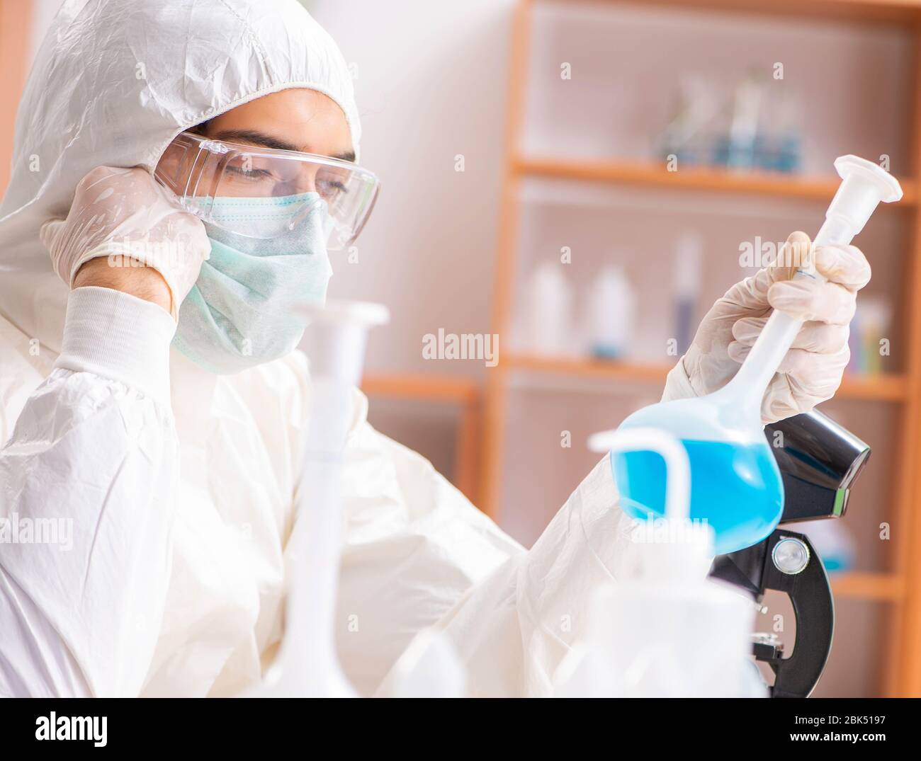 The young biochemist wearing protective suit working in the lab Stock ...
