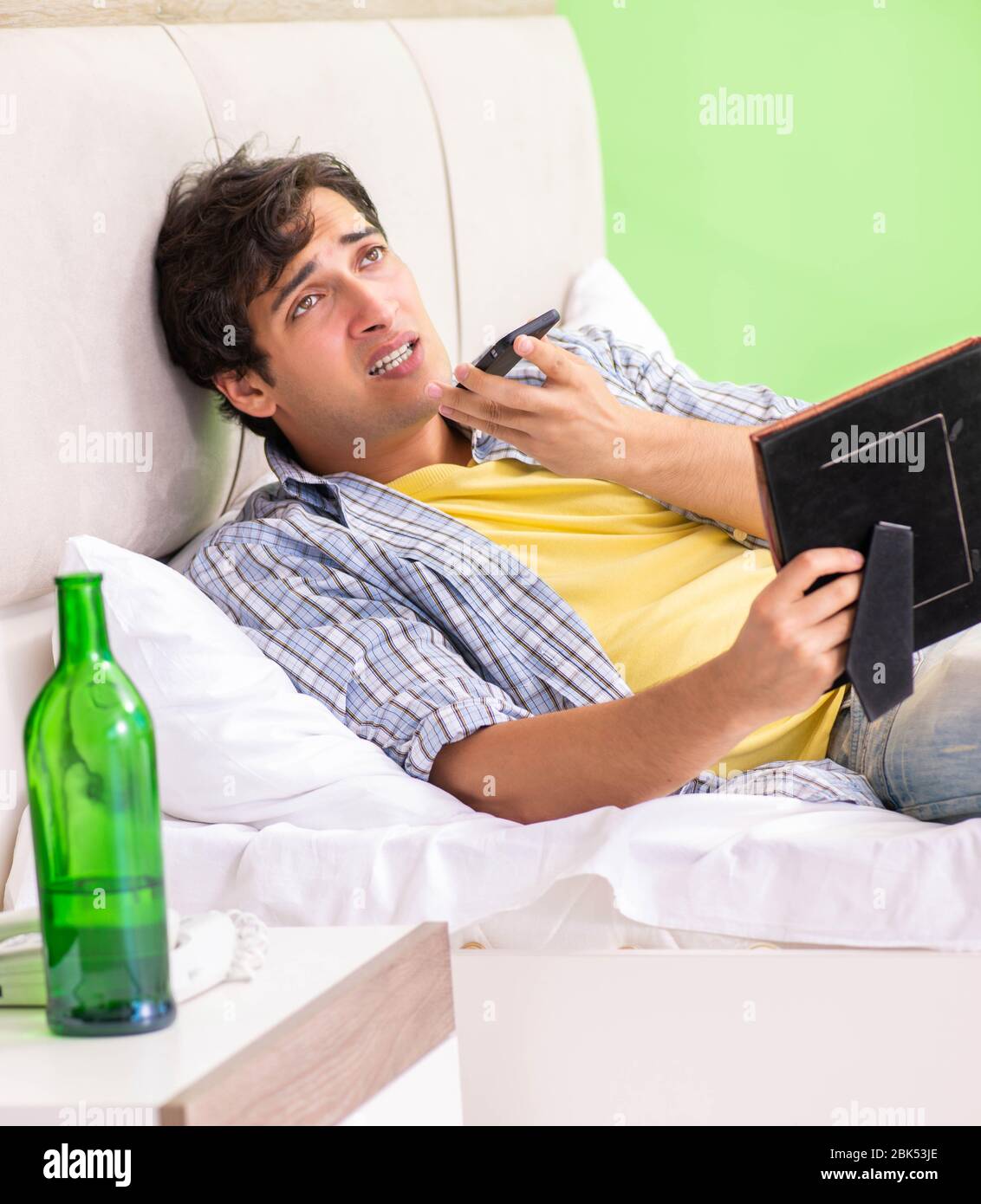 The young man sad in unhappy love concept Stock Photo - Alamy