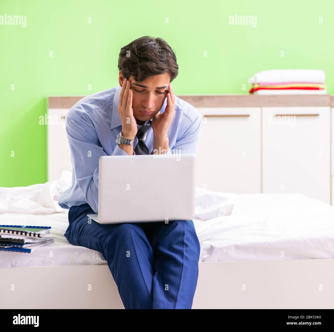 The businessman working overtime in hotel room Stock Photo - Alamy