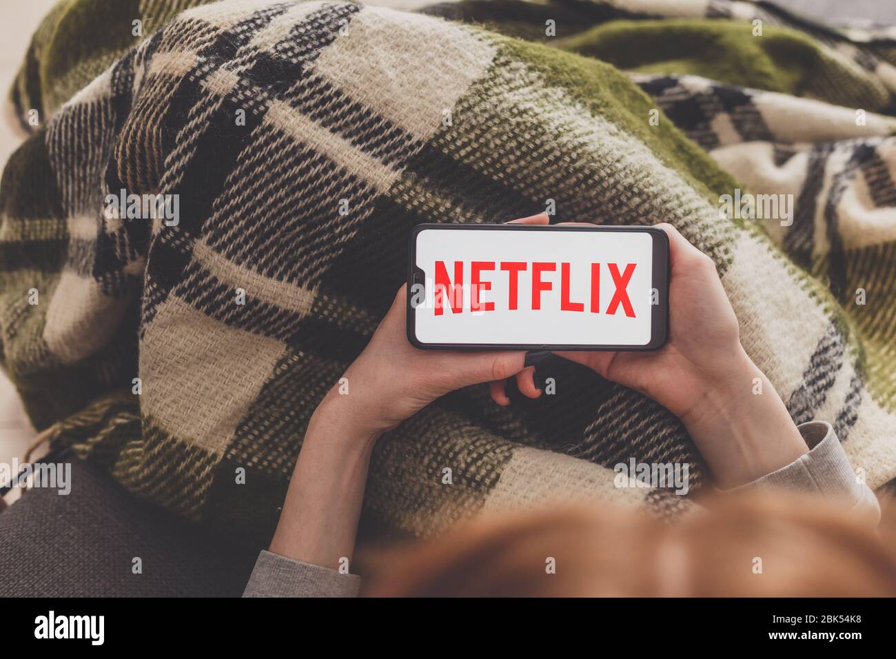 Watching netflix sofa hi-res stock photography and images - Alamy