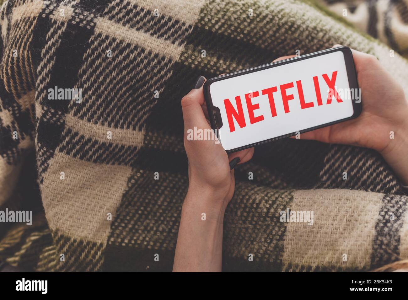Watching netflix sofa hi-res stock photography and images - Alamy