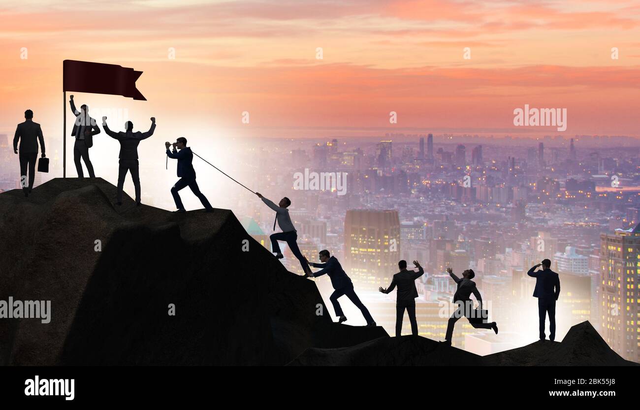 Concept of teamwork with team climbing mountain Stock Photo - Alamy