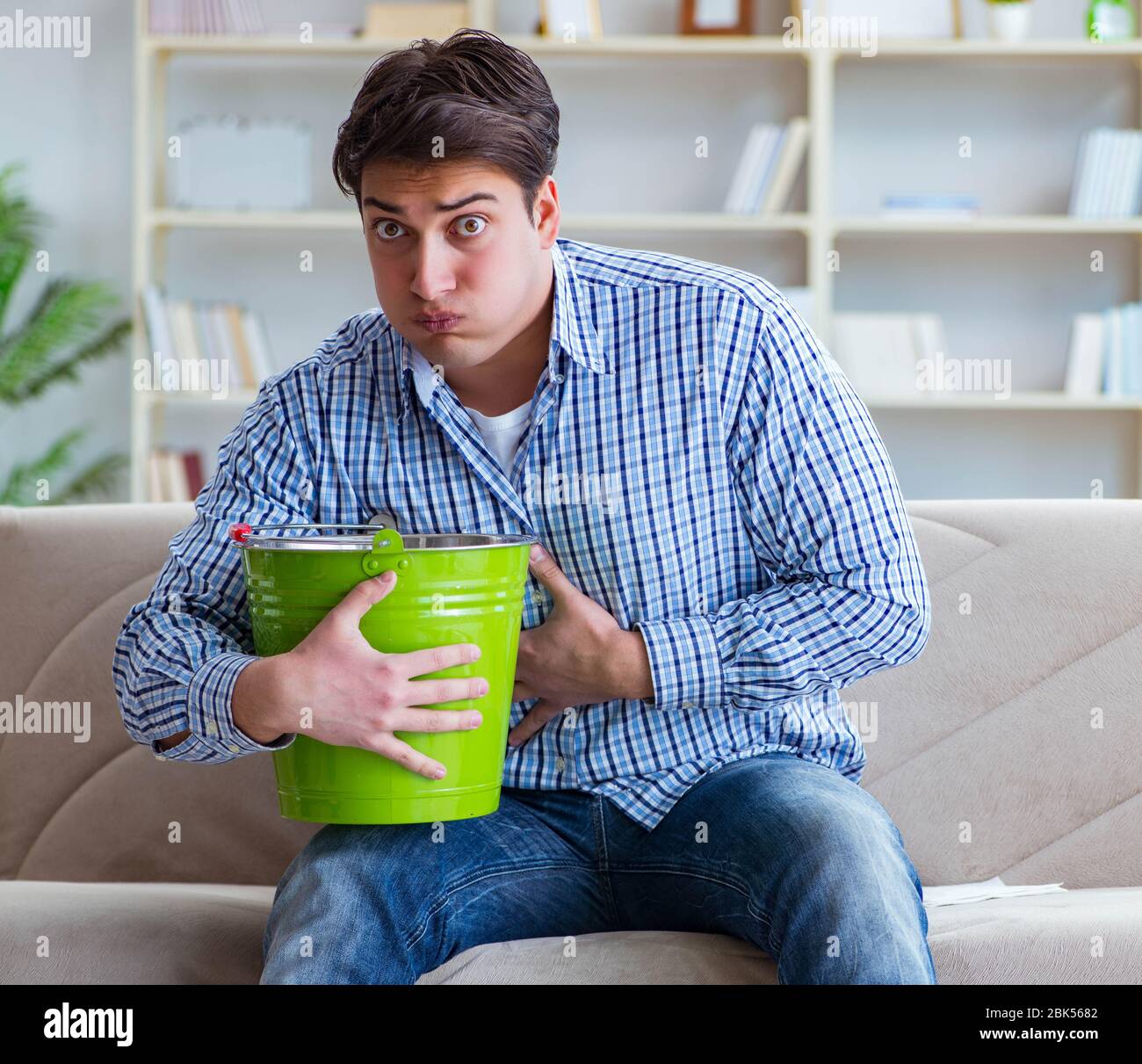 The sick man suffering at home from infection and bad stomach Stock ...