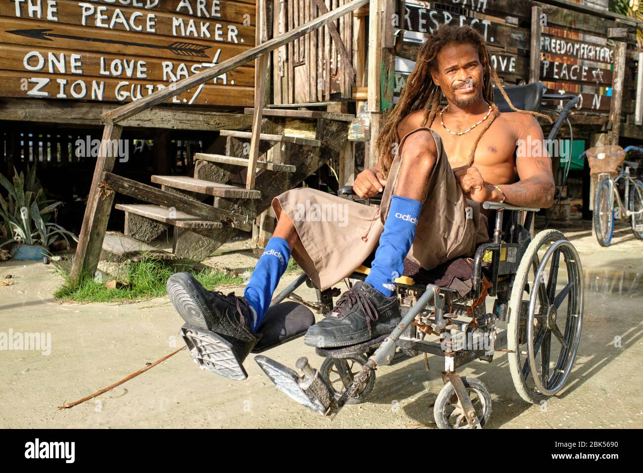 Portrait of a Belizean man with dreadlocks on a wheelchair Stock Photo ...