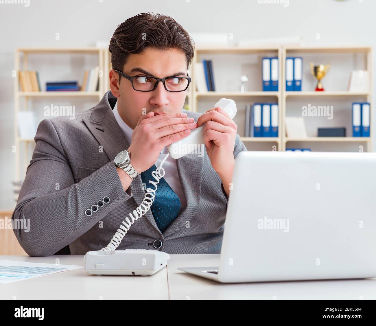 The businessman leaking confidential information over phone Stock Photo ...