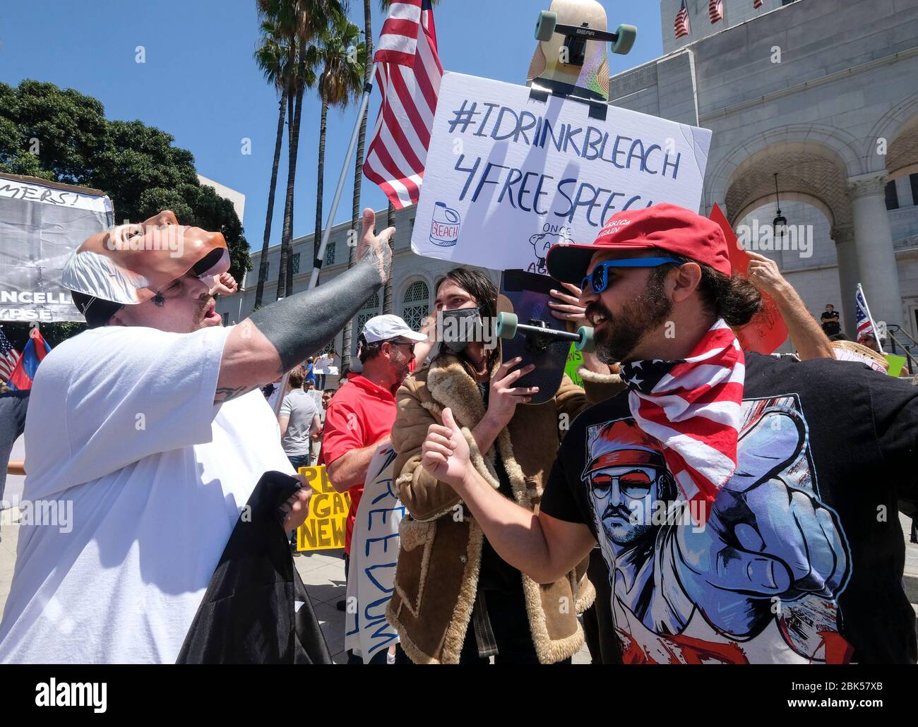 Los Angeles, California, USA. 1st May, 2020. A demonstrator (R) argues ...