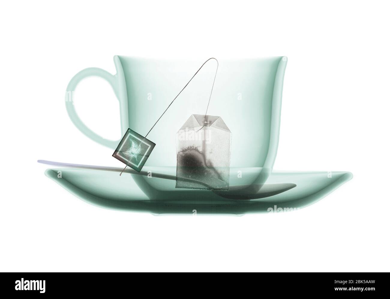 Teacup saucer teaspoon and teabag, coloured X-ray Stock Photo - Alamy