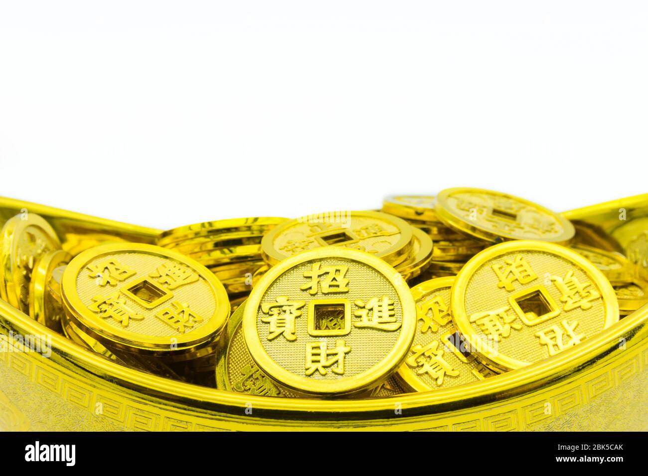 Chinese gold ingots and coins isolated on white background (Foreign ...