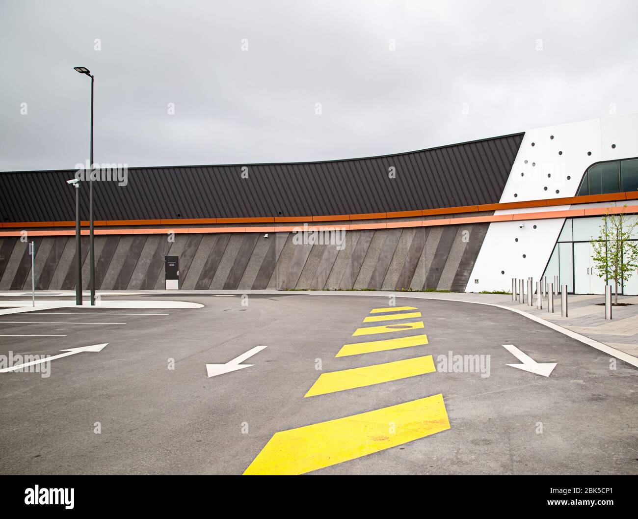 Urban images of a new large commercial building with road markings and ...