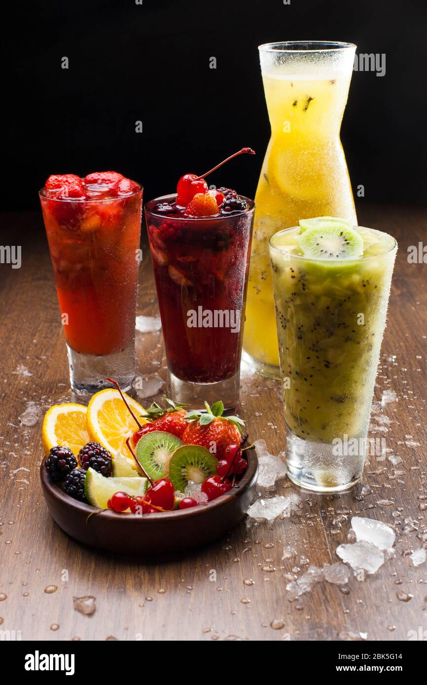 delicious cold drinks of colorful tropical fruits, strawberry, kiwi ...