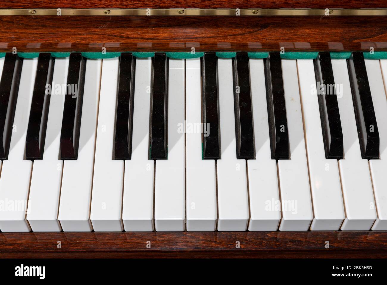 Old piano keys in brown textured wood Stock Photo - Alamy