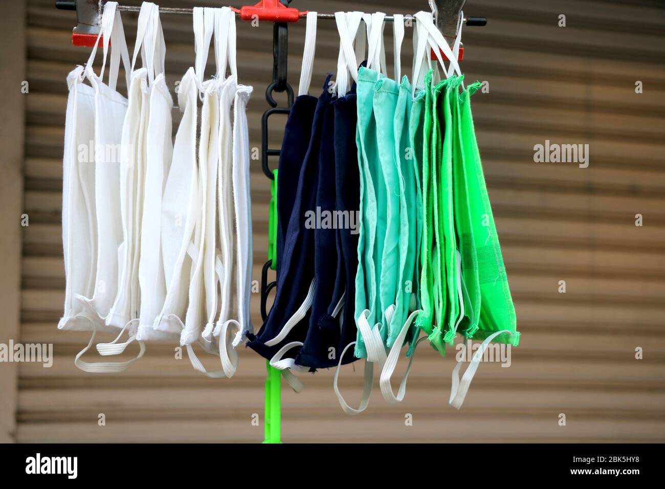 colorful homemade cloth face mask selling on street side during lock ...