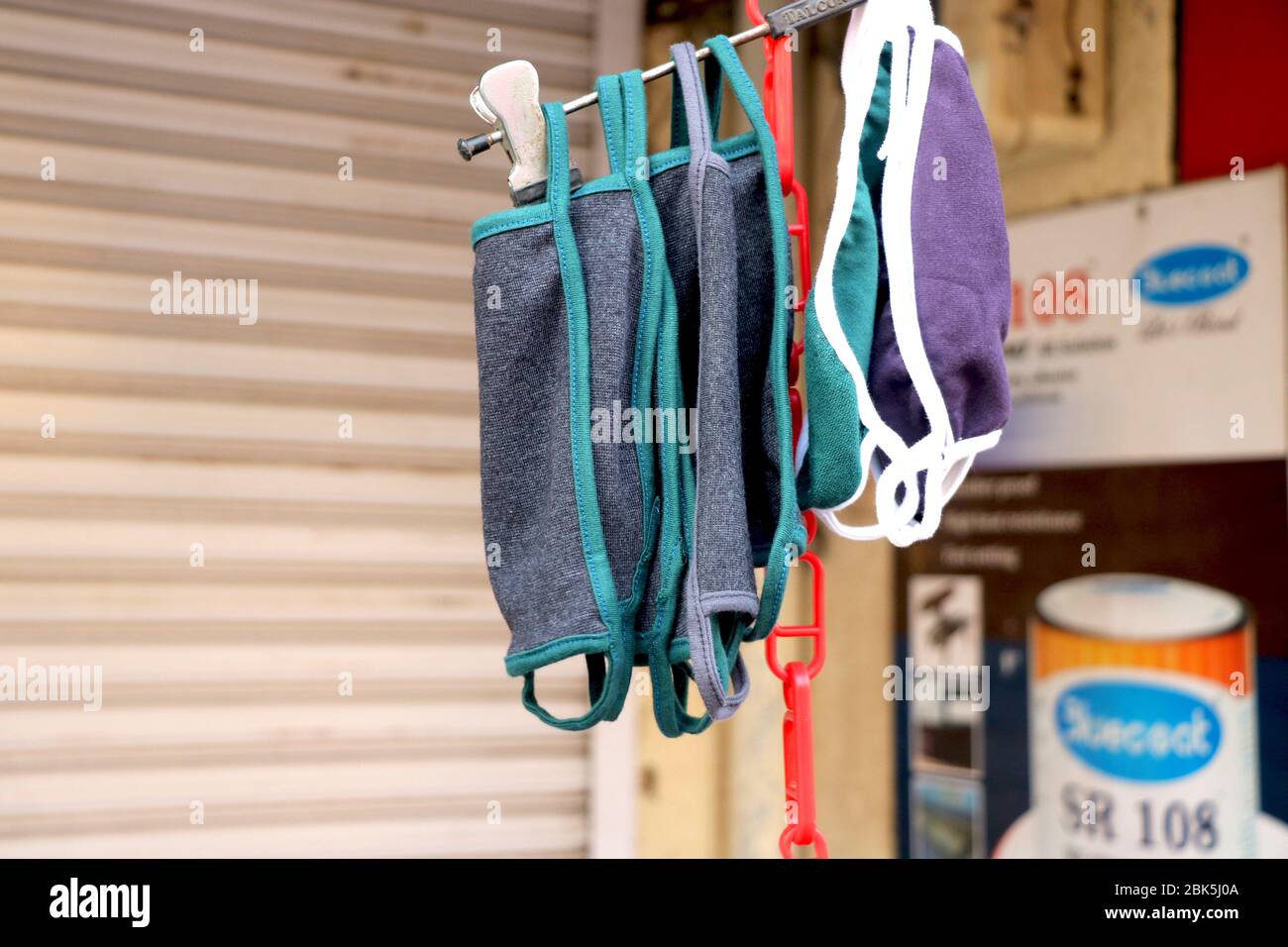 colorful homemade cloth face mask selling on street side during lock ...