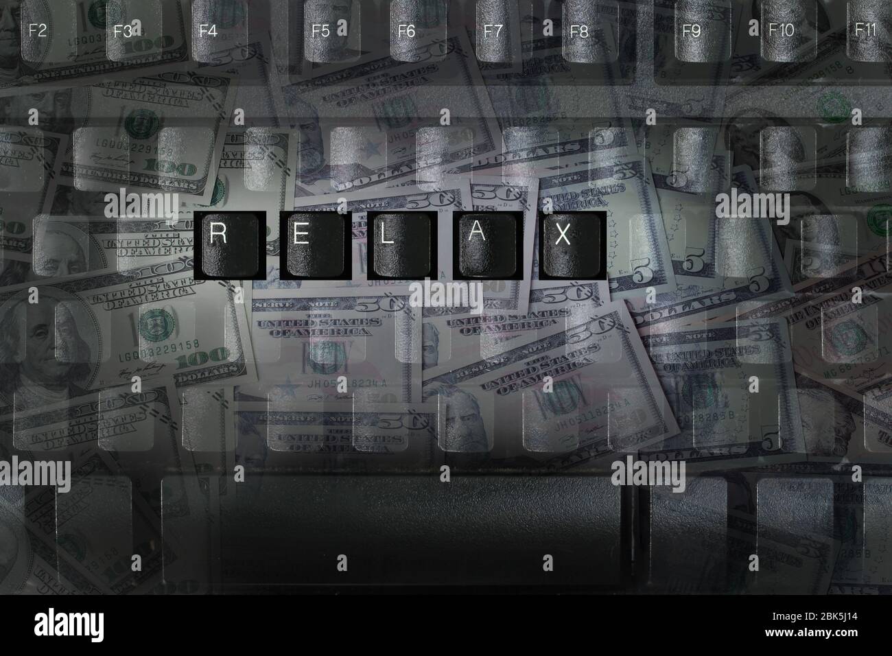 Overlay keyboard R E L A X on Dollar money ,The USA banknote and ...