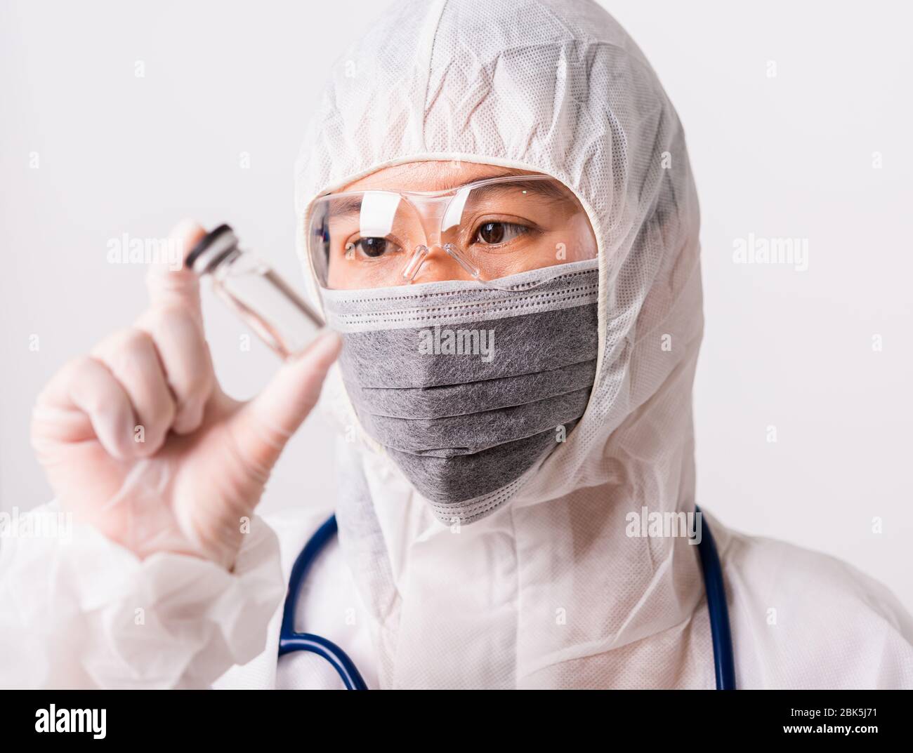 Asian female woman doctor or nurse in PPE uniform and gloves with ...
