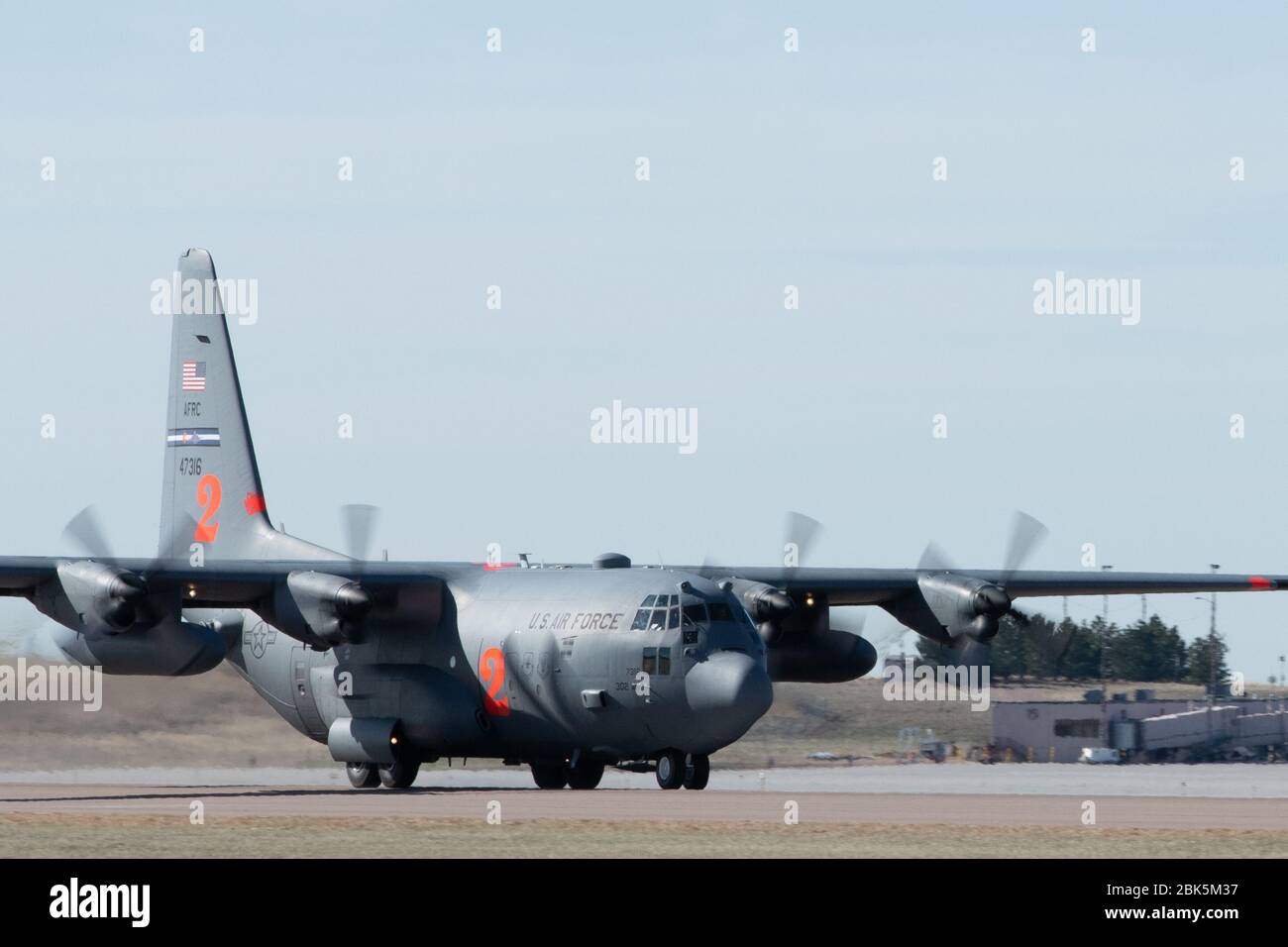 Aircrew from the 302nd Airlift Wing prepare for takeoff aboard a C-130 ...