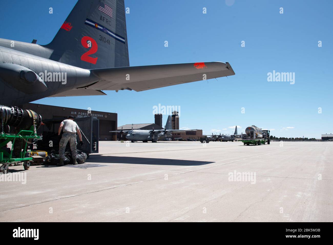 Members of the 302nd Airlift Wing load a U.S. Forest Service Modular ...