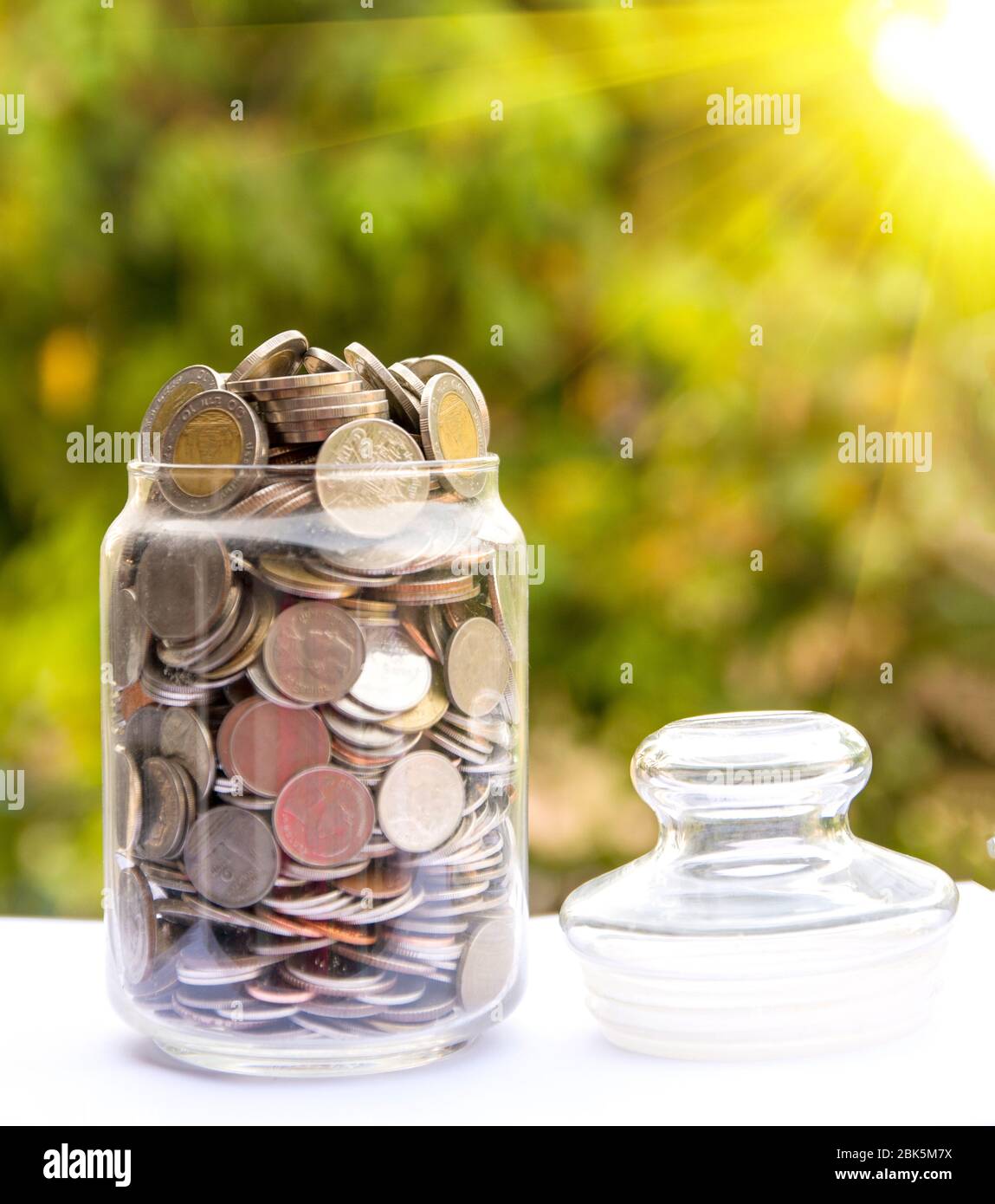 money coins , Saving for buy home concept Stock Photo - Alamy