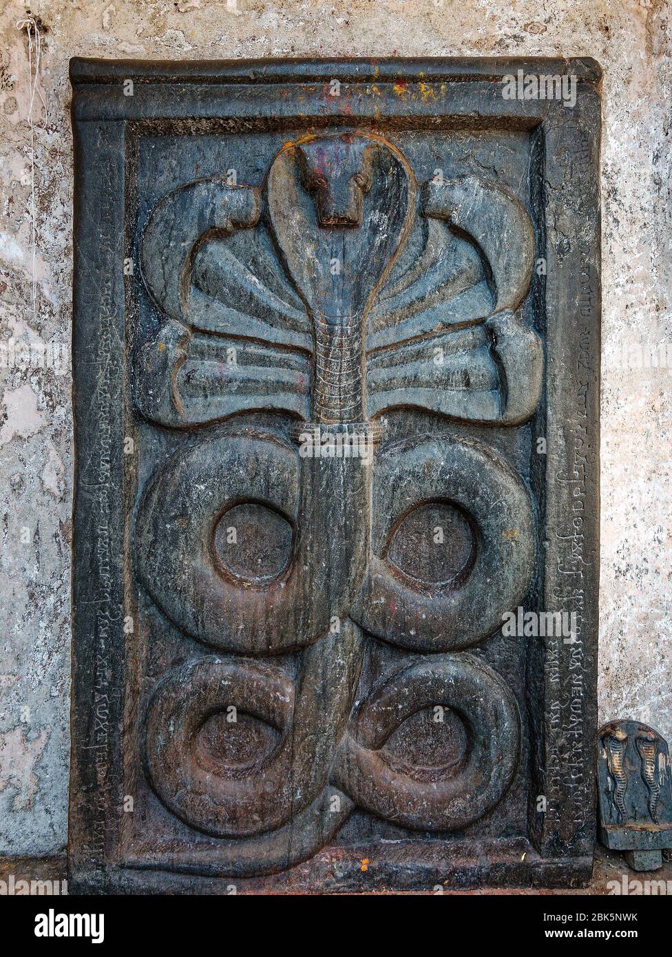Relief carving of snake god Stock Photo - Alamy