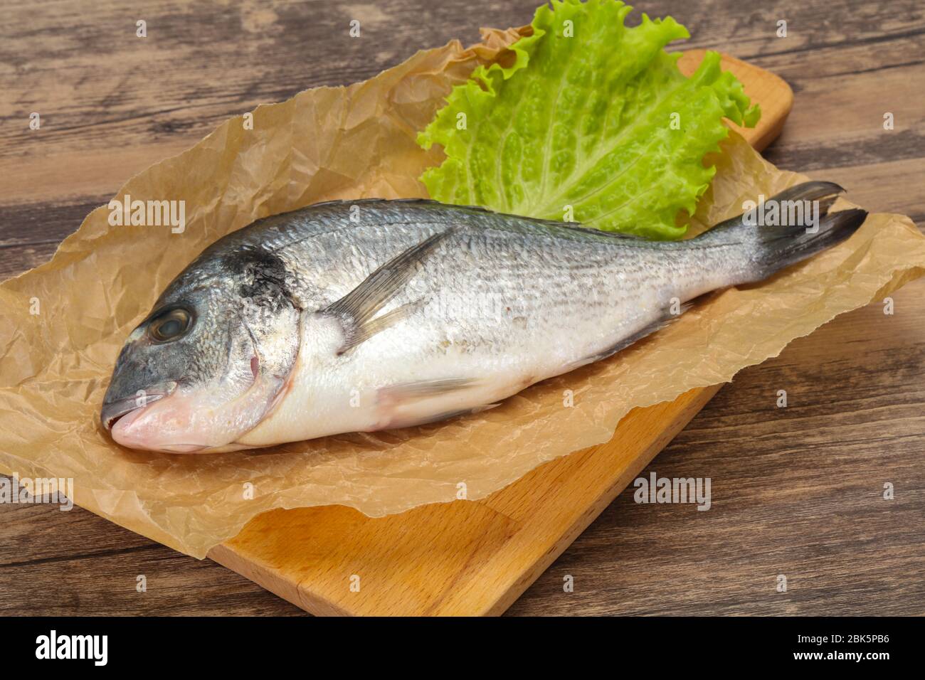 Raw Dorada fish ready for cooking Stock Photo - Alamy