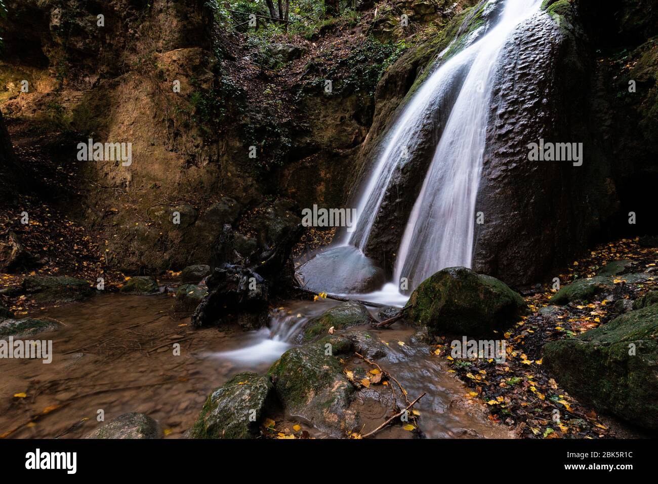 Waterfall in the woods in Pale (Umbria, Italy) with autumn leaves on ...
