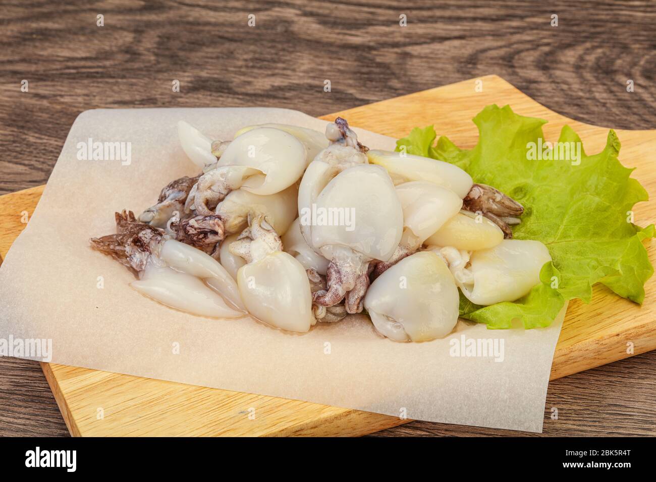 Raw seafood - cuttlefish for cooking over board Stock Photo - Alamy