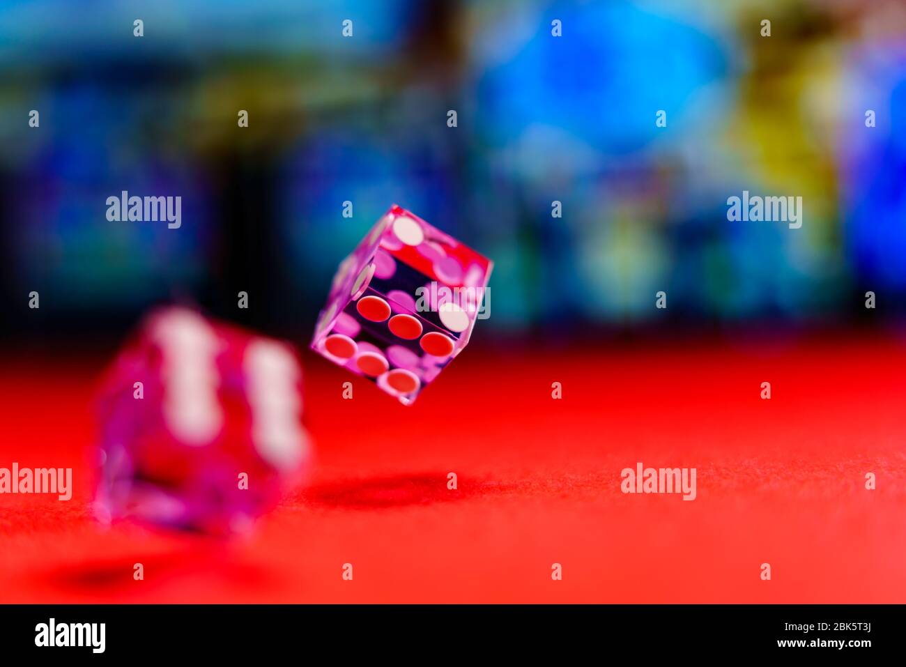 Close up two rolling dice hi-res stock photography and images - Alamy