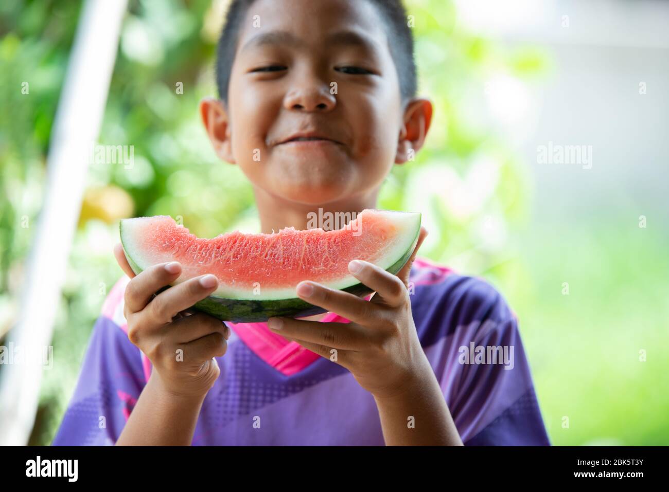 Boy eating watermelon hi-res stock photography and images - Alamy