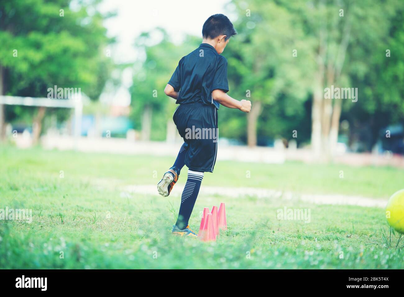 boys soccer teams playing a football match on the stadium Stock Photo ...