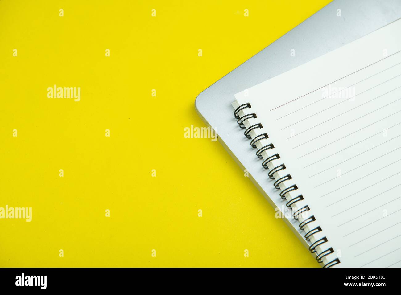 top view of Yellow office desk table with a lot of things on it Stock ...