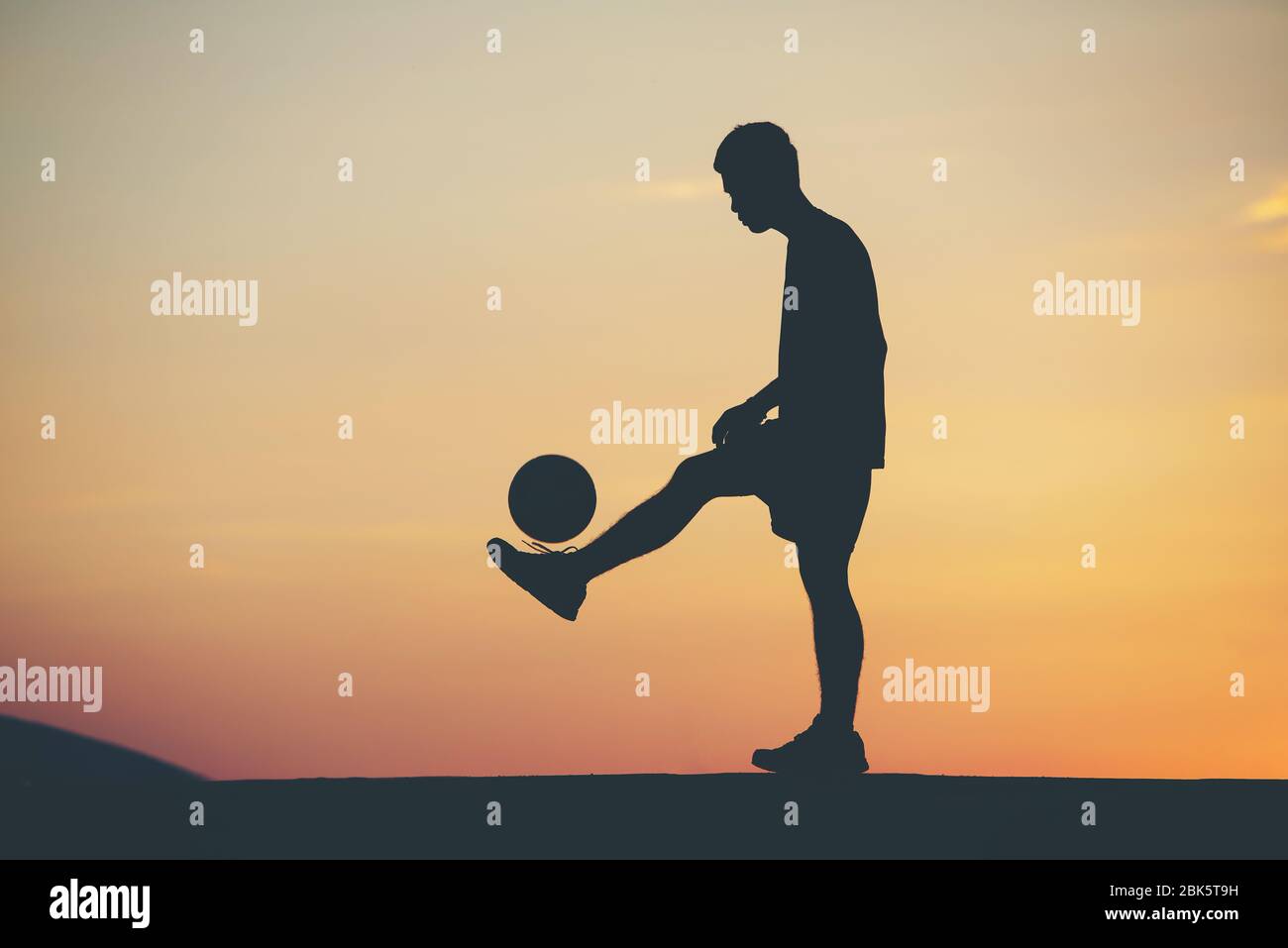 Kids playing soccer sun in sky hi-res stock photography and images - Alamy